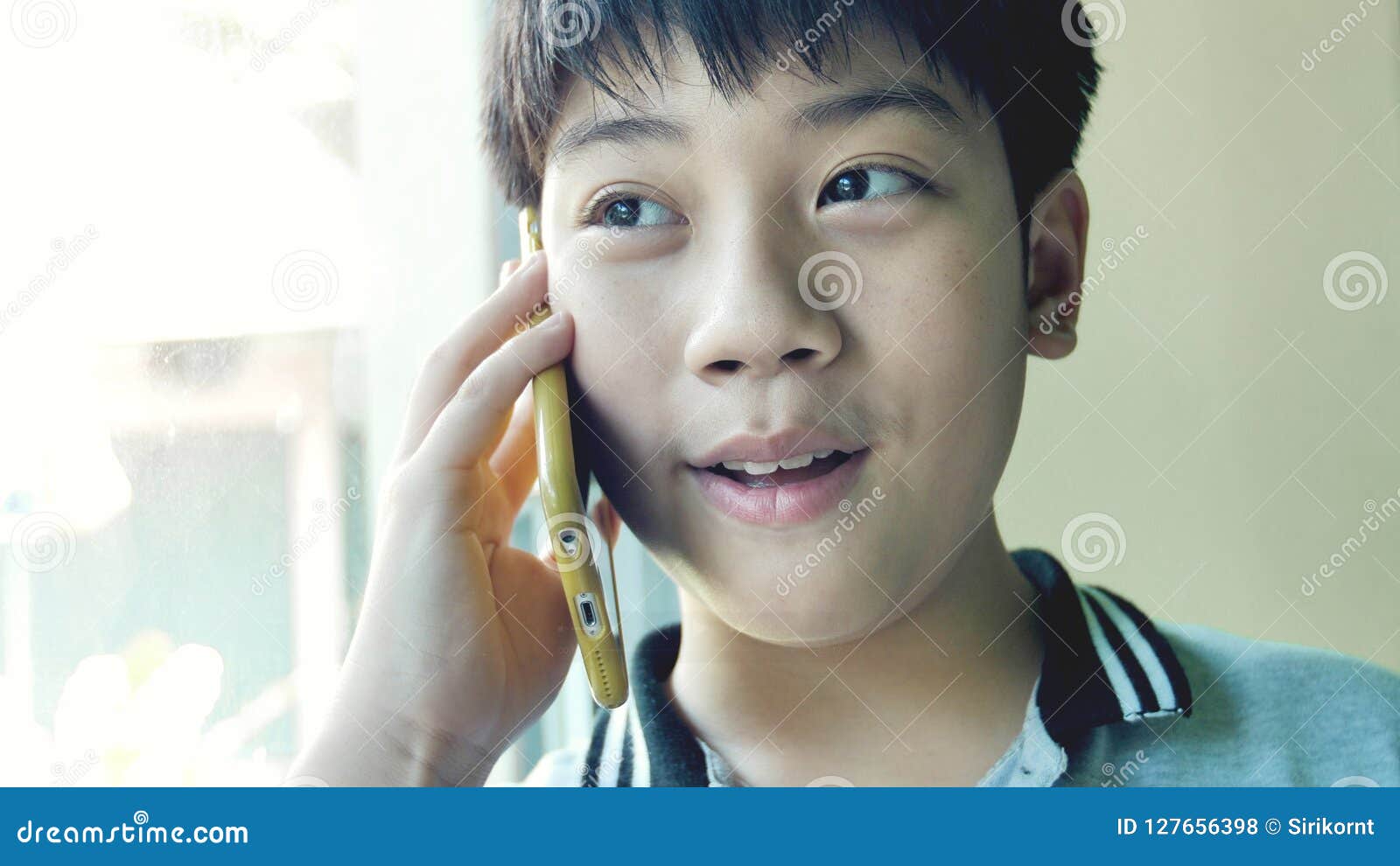Happy Asian Boy Talking with Cell Phone with Smile Face. Stock Photo ...