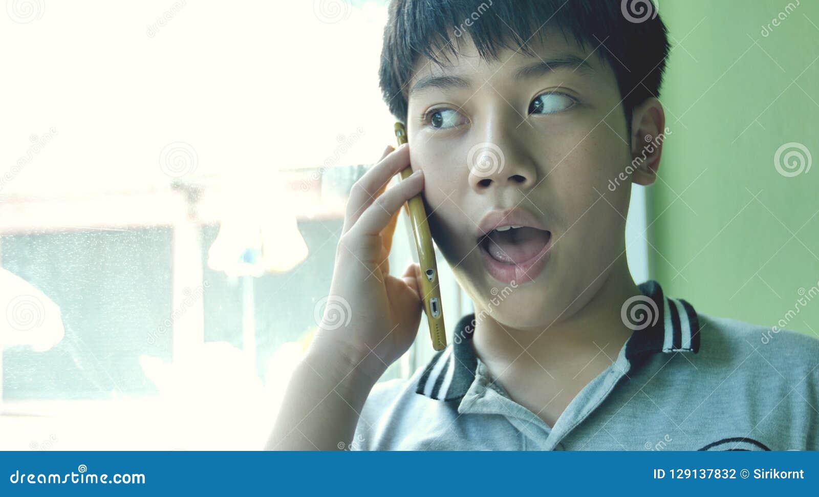 Happy Asian Boy Talking with Cell Phone with Smile Face. Stock Photo ...