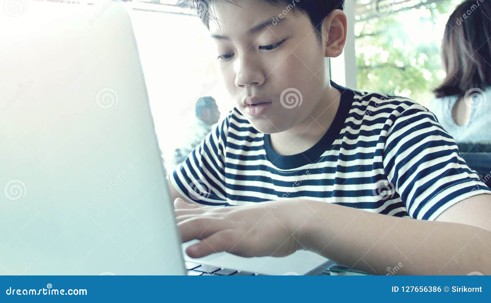 Happy Asian Boy Typing on Laptop Computer. Stock Photo - Image of ...
