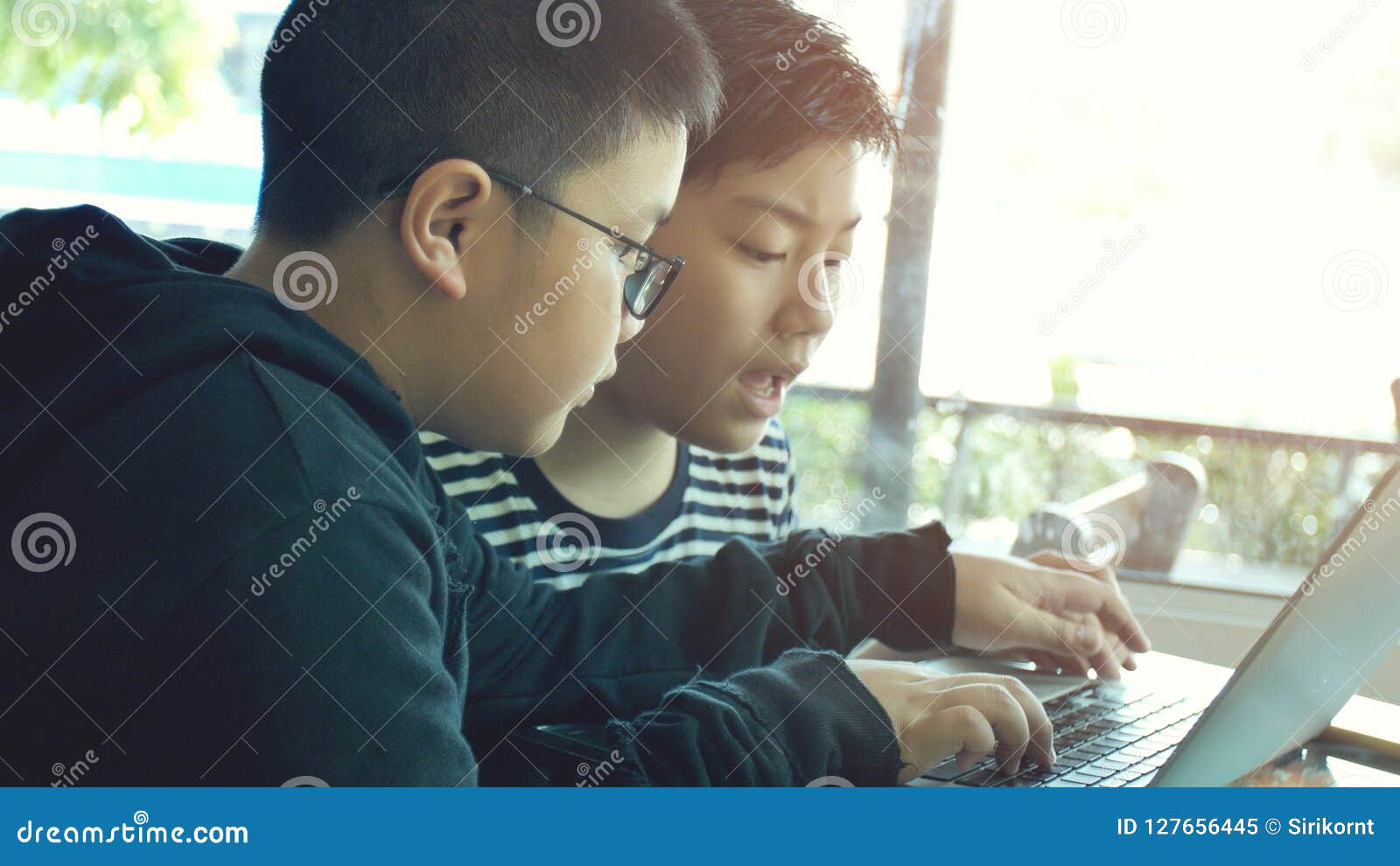 Happy Asian Boy Typing on Laptop Computer. Stock Image - Image of game ...