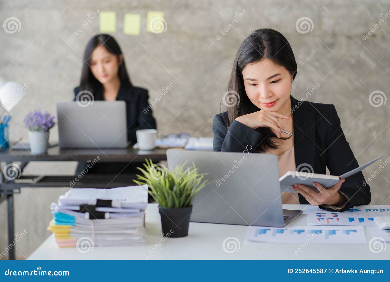 Happy Asian Businesswoman Using Laptop Computer while Doing Financial ...