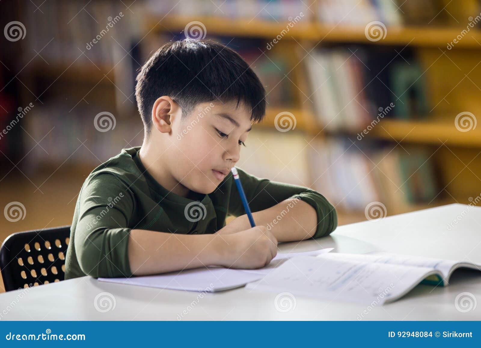 Happy Asian Child Doing Homework with Smile Face. Stock Photo - Image ...