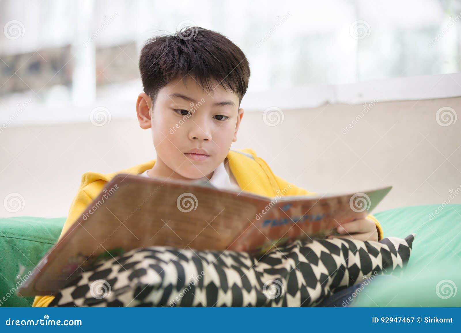 Happy Asian Child Reading Book with Smile Face. Stock Image - Image of ...