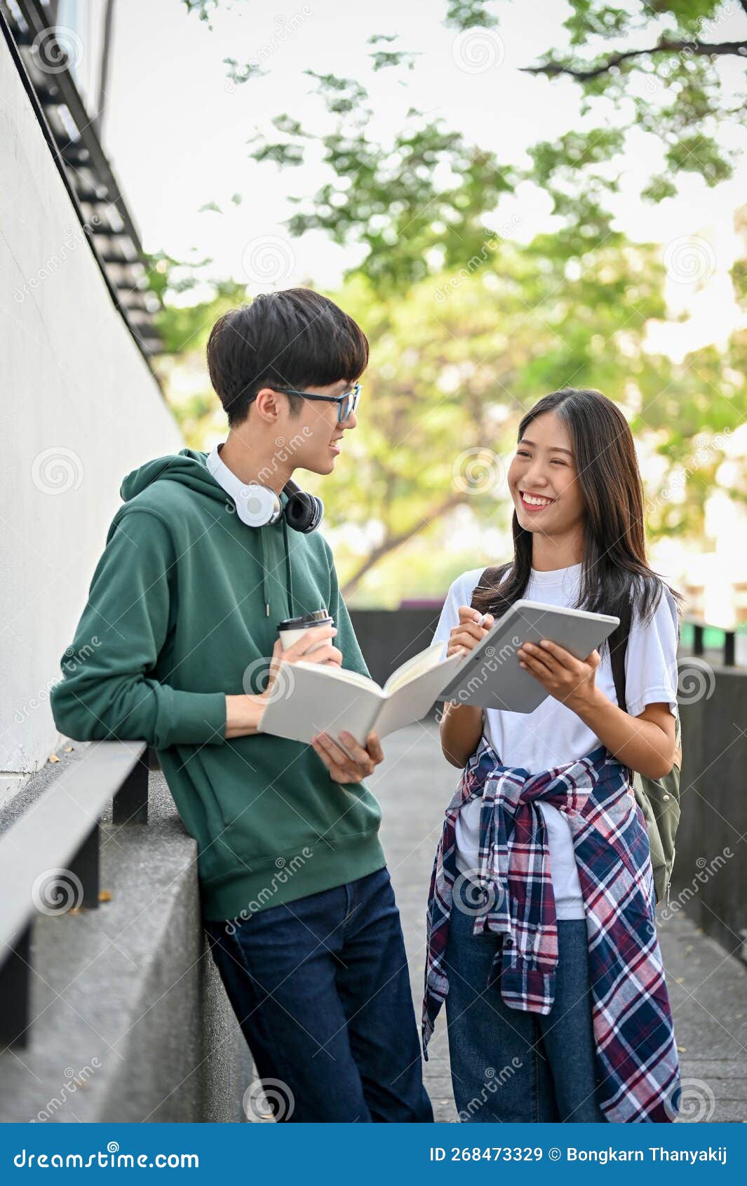 Happy Asian College Students Talking and Sharing Ideas on a School ...