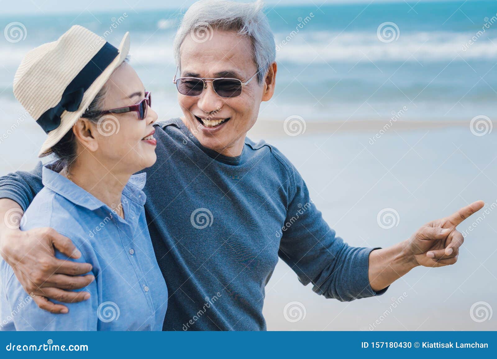 Happy Asian Couple Senior Eldery Retirement Resting At Beach Honeymoon