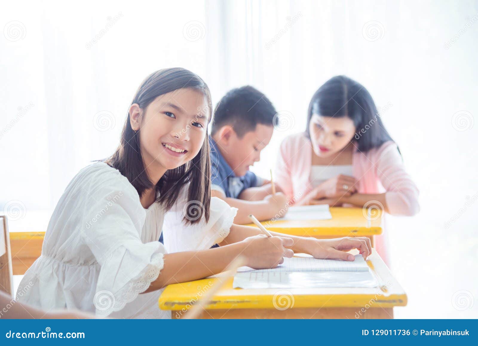 Happy Student Studying in Classroom Stock Photo - Image of grade, exam ...
