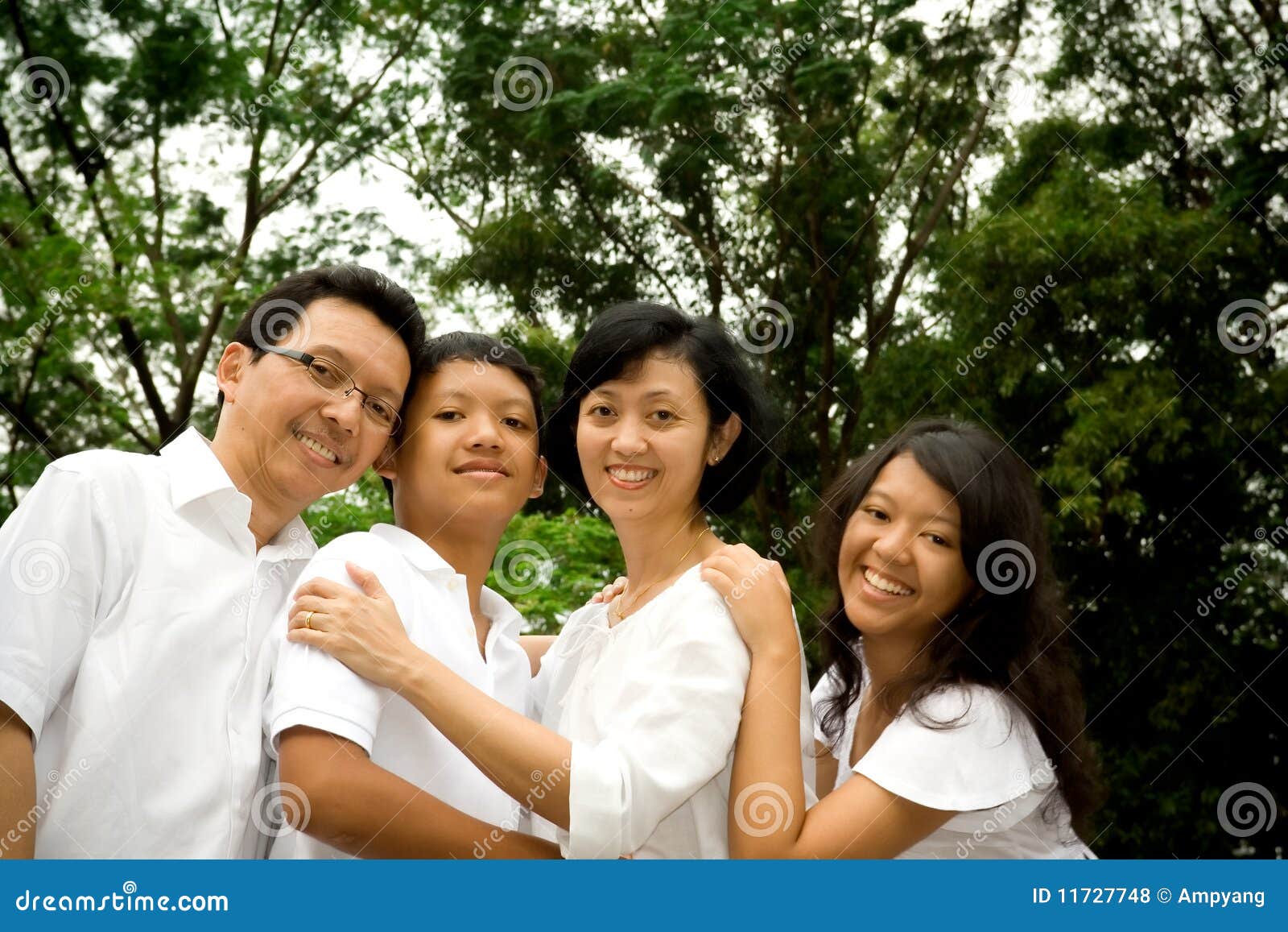 Happy Asian family stock photo. Image of embrace, group - 11727748
