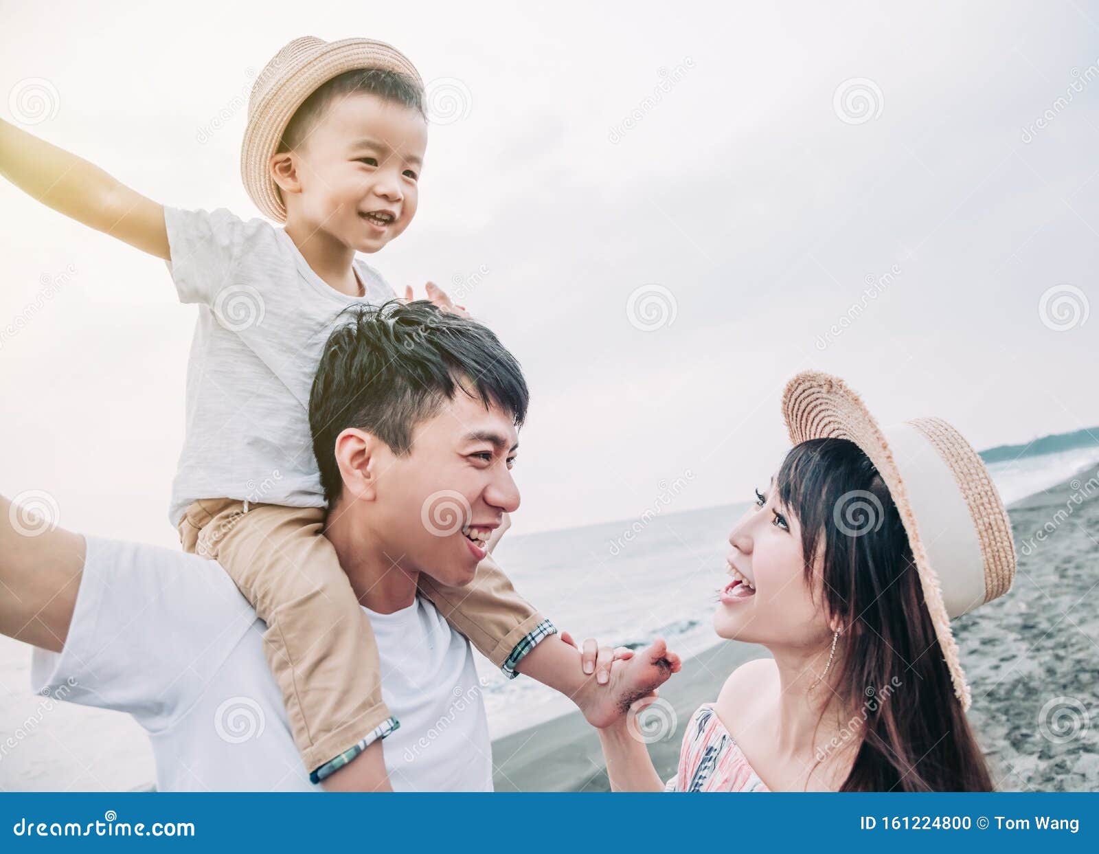 Happy Asian Family Playing on the Beach at Stock Photo - Image of ...