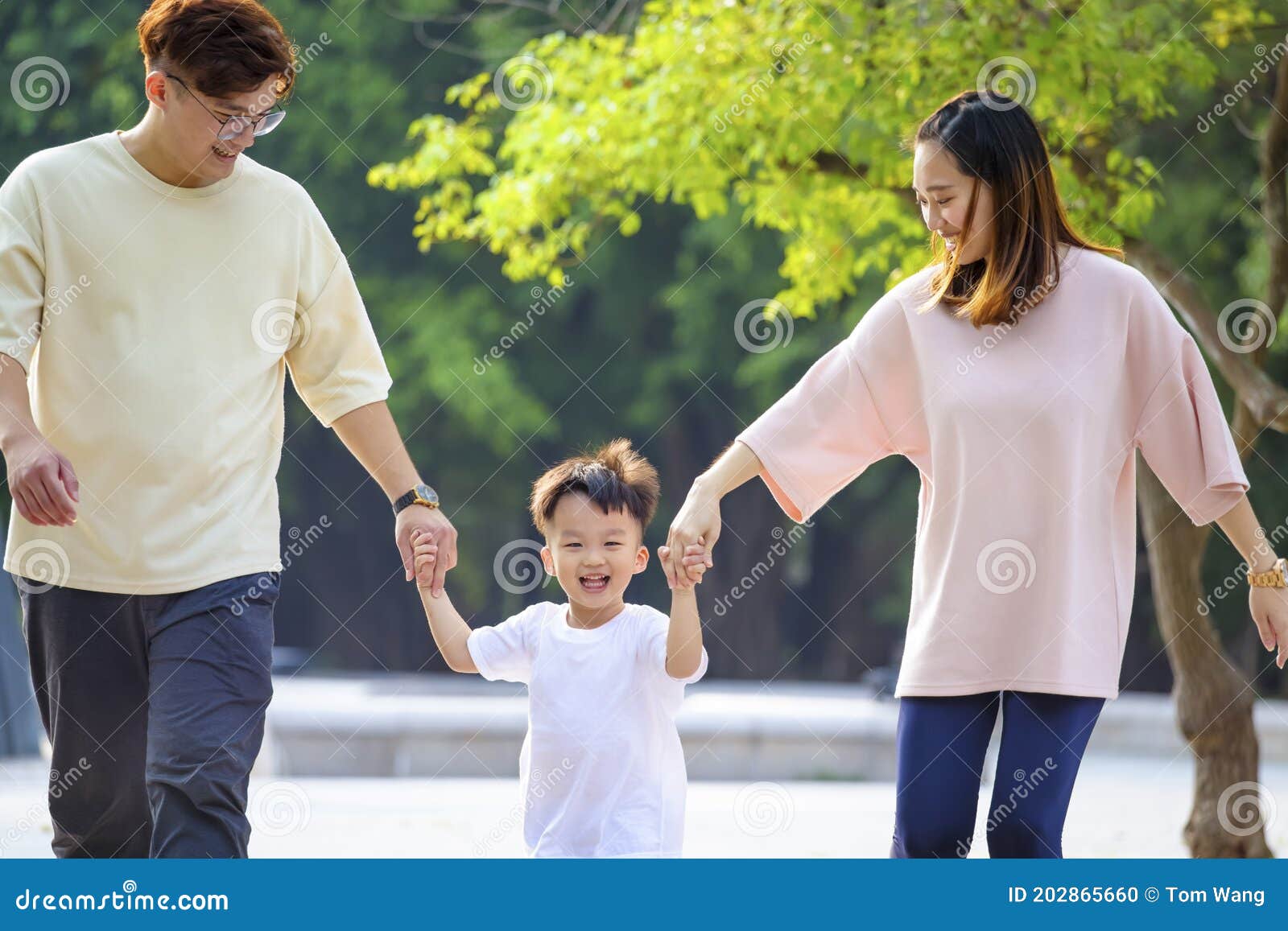 Happy Asian Family Walking in the Park Stock Photo - Image of father ...
