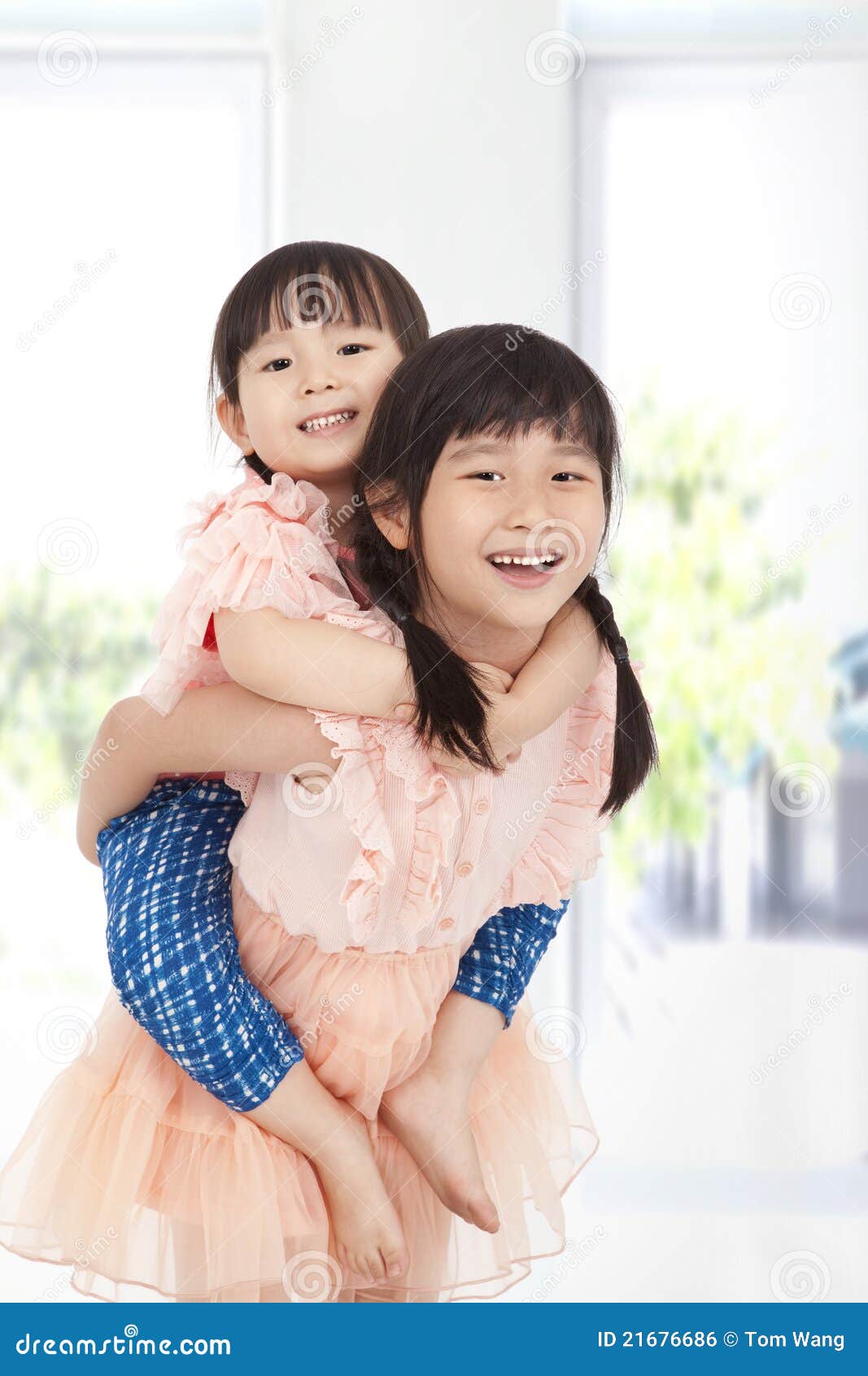 Two Asian Girls Are Laughing And Enjoying Studying English Alphabet ...