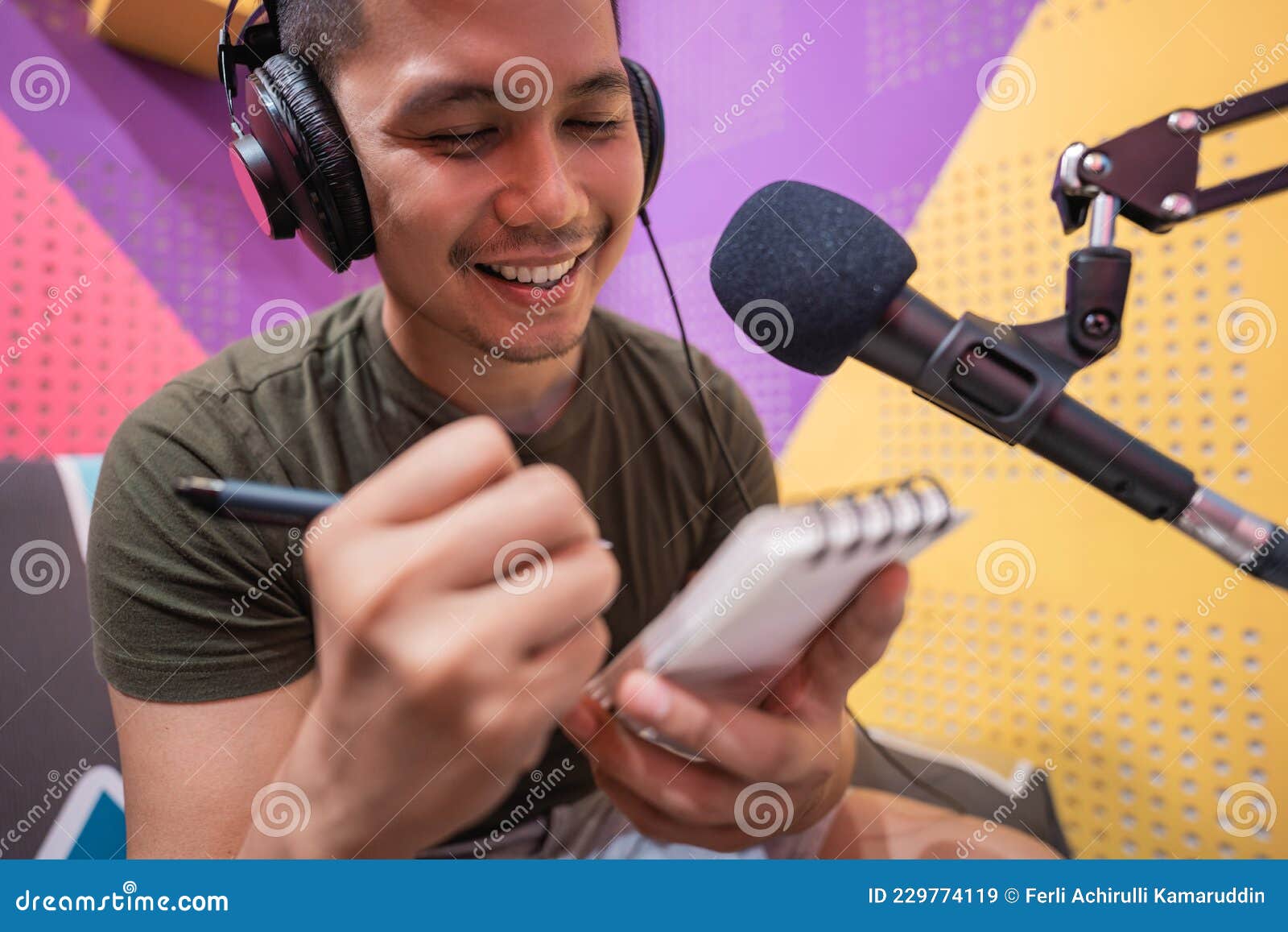 Happy Asian Man is Recording a Podcast in His Studio Take Note Stock ...