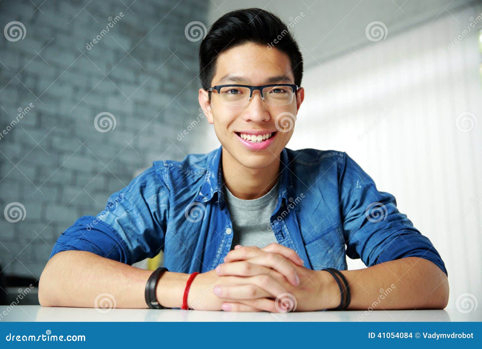 Happy Asian Man Sitting at the Table Stock Photo - Image of cheerful ...