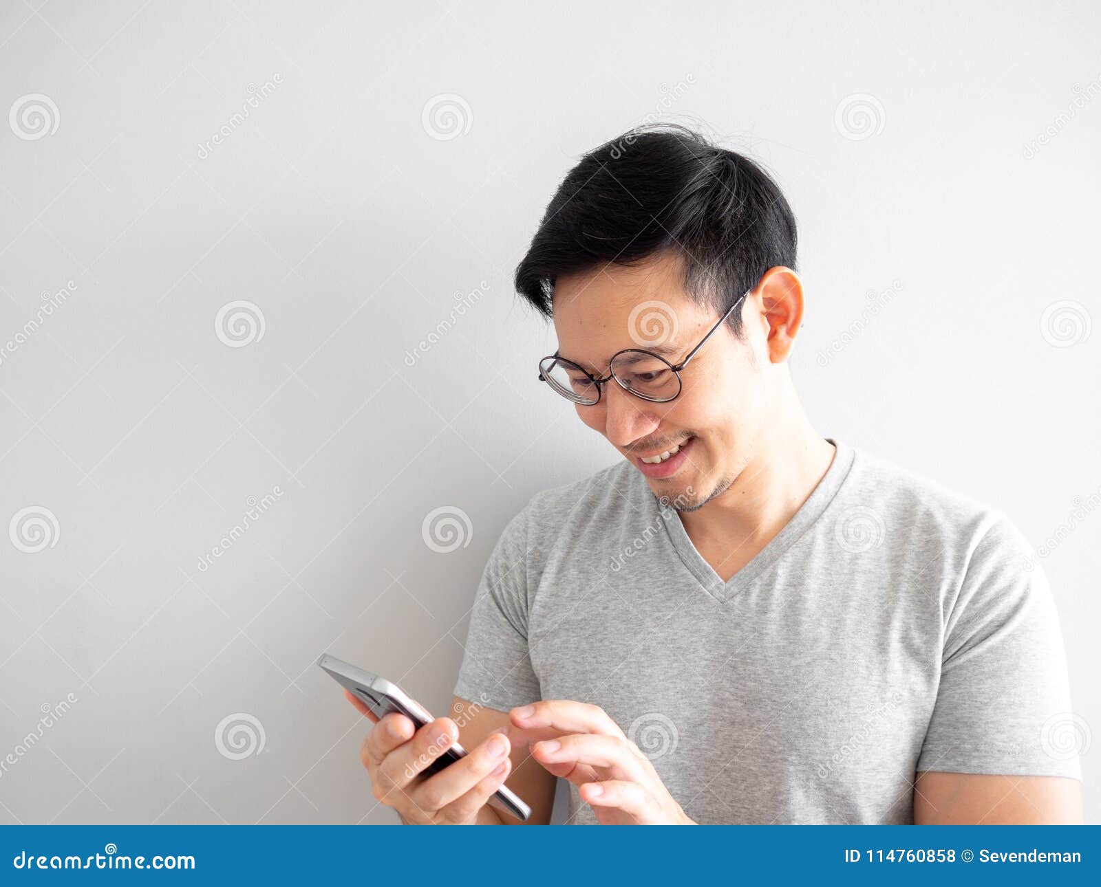 Happy Man is Using Smartphone. Concept of Using Social Media on Stock ...