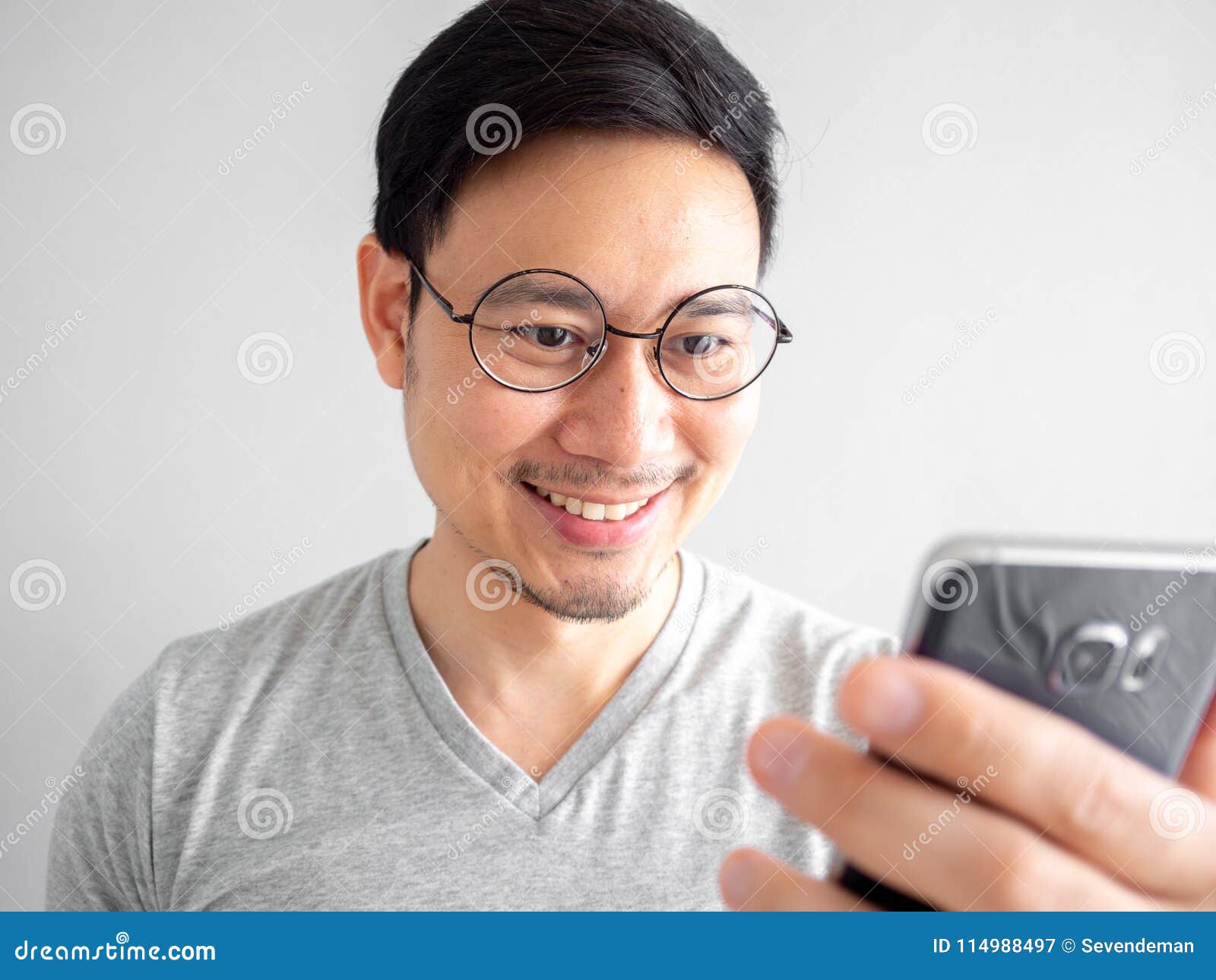 Happy Man is Using Smartphone. Concept of Using Social Media on Stock ...