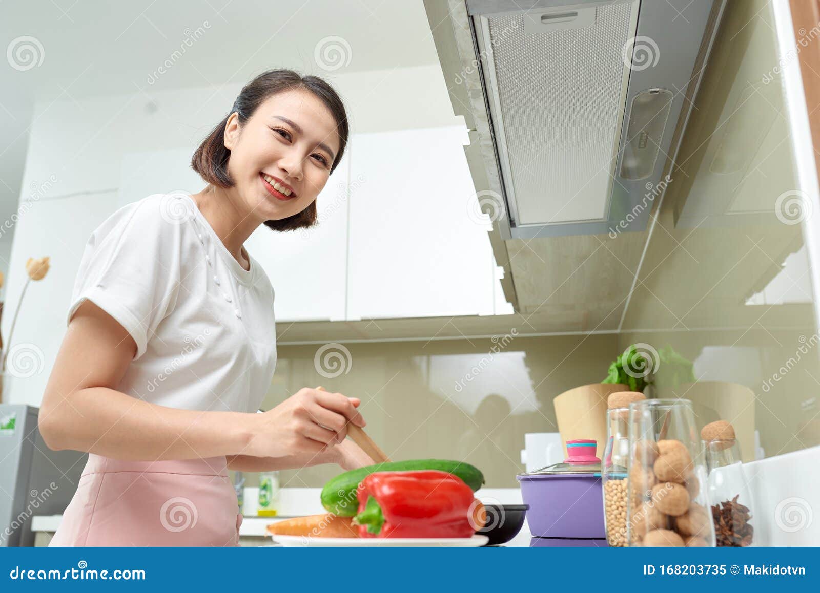 Happy Asian Woman Cooking in the Kitchen Stock Image - Image of ...