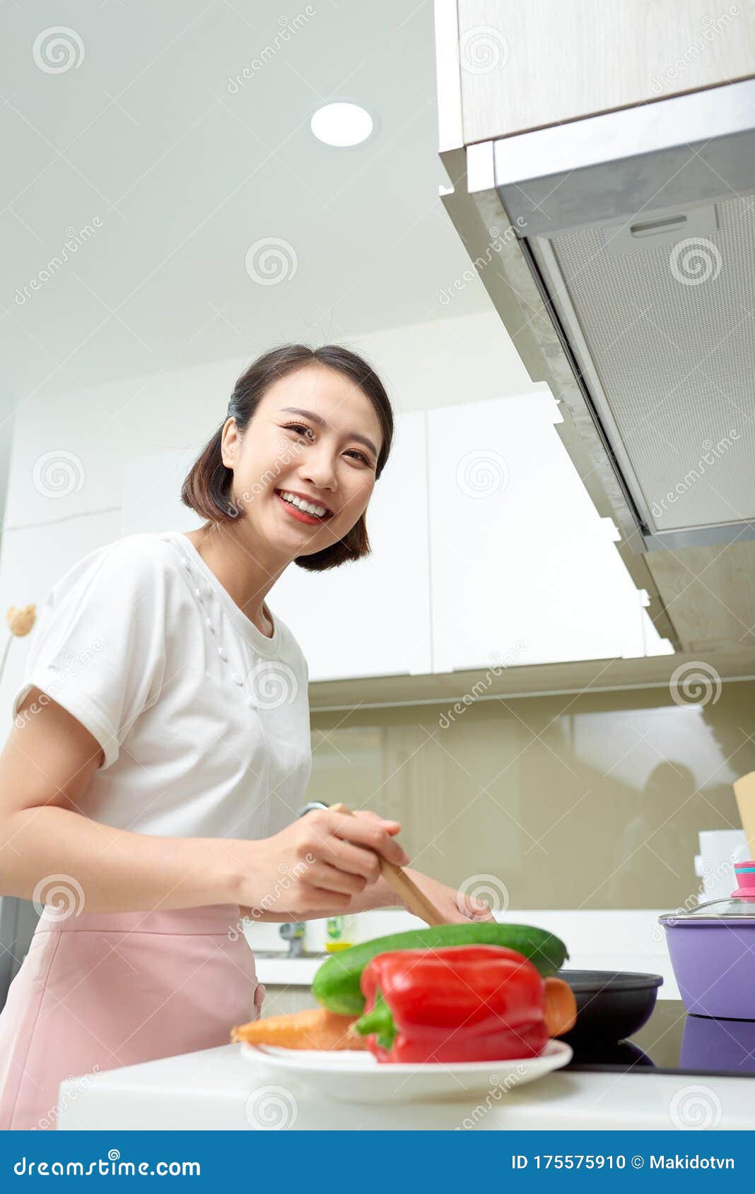 Happy Asian Woman Cooking in the Kitchen Stock Photo - Image of apron ...