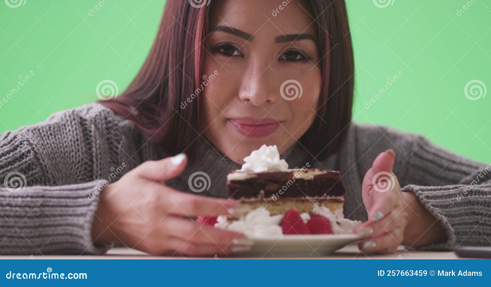 Happy Asian Woman Eating Cake On Green Screen Stock Video Video Of