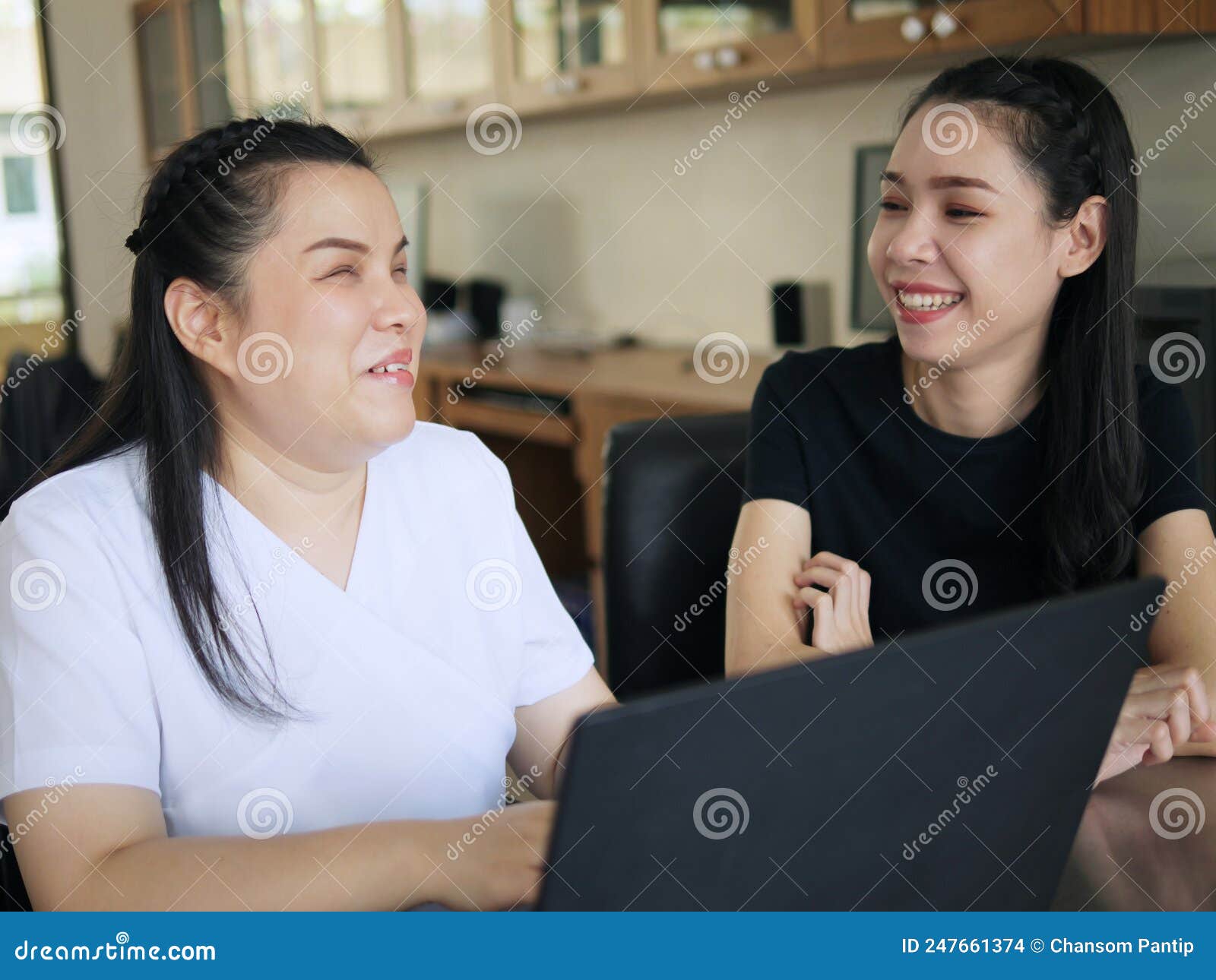 Happy Asian Women Co-workers in Workplace Including Person with ...