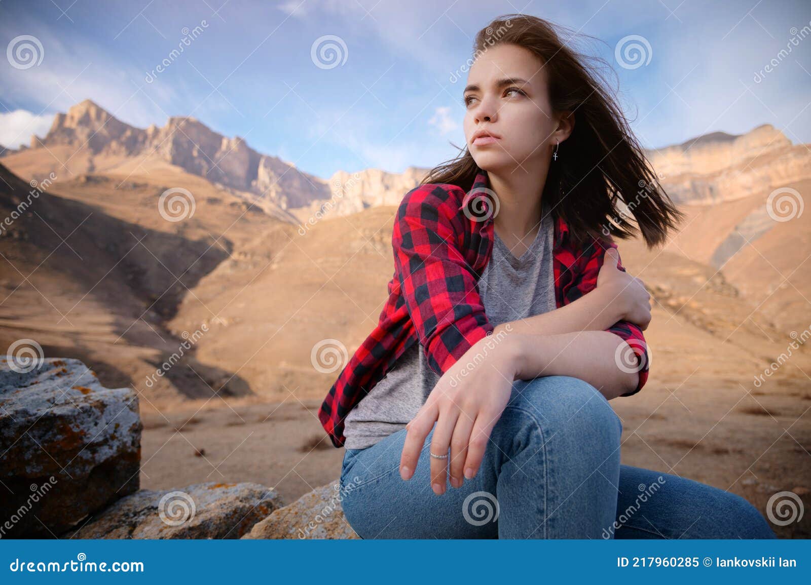 Happy Attractive Hipster Traveler Girl With Windy Hair And Smiling On A