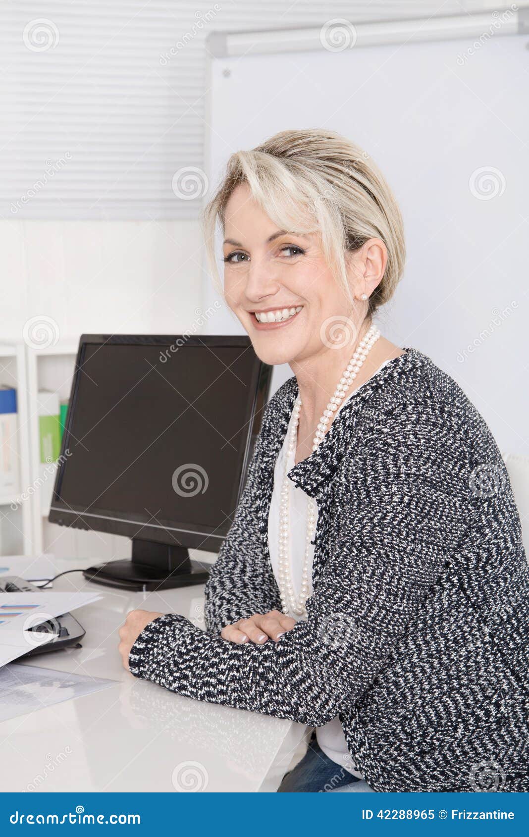 Happy Attractive Senior Female Manager in Portrait Sitting at De Stock ... Happy Attractive Senior Female Manager in Portrait Sitting at De Stock ...