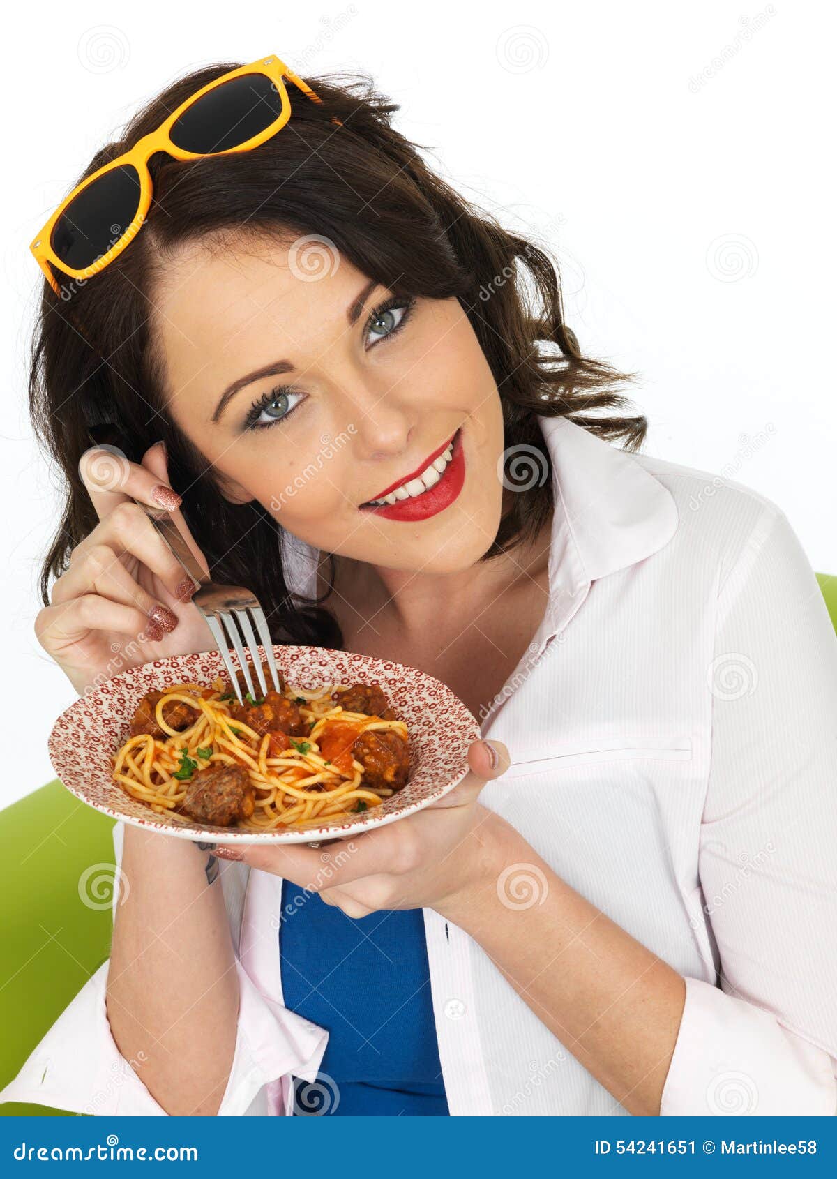 Happy Attractive Young Woman Holding A Plate Of Spaghetti Meatballs