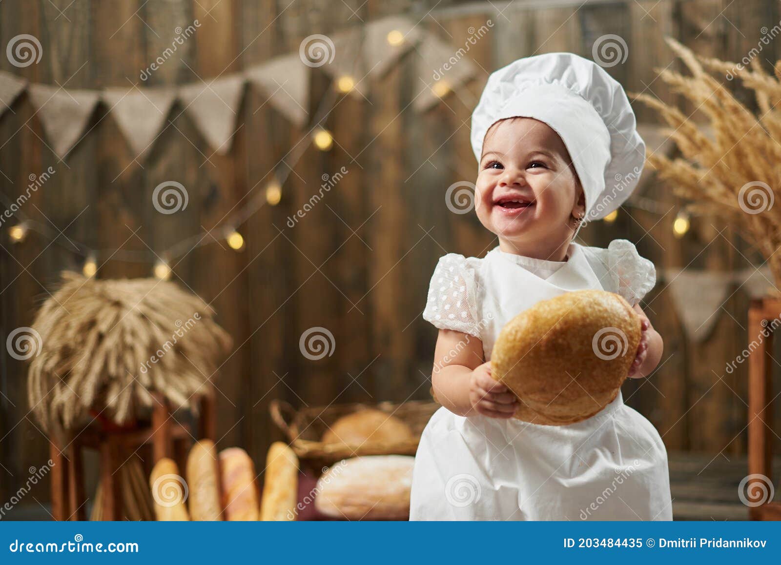 Happy Baby Baker Holding Bread and Smiling Stock Image - Image of ...