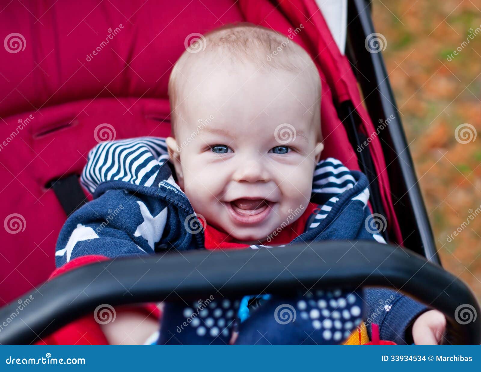 Happy Baby Boy Sitting in a Stroller Stock Photo - Image of beautiful ...