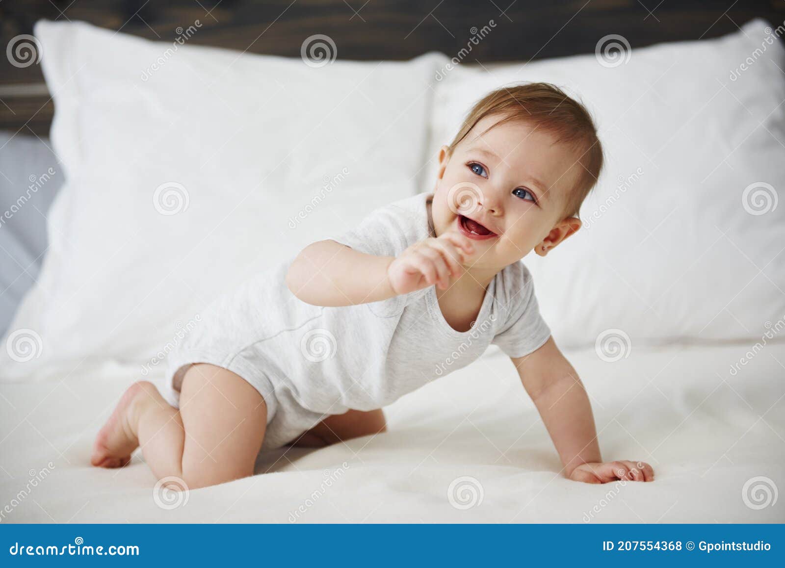 Happy Baby Crawling on the Bed Stock Photo - Image of babyhood, smile ...