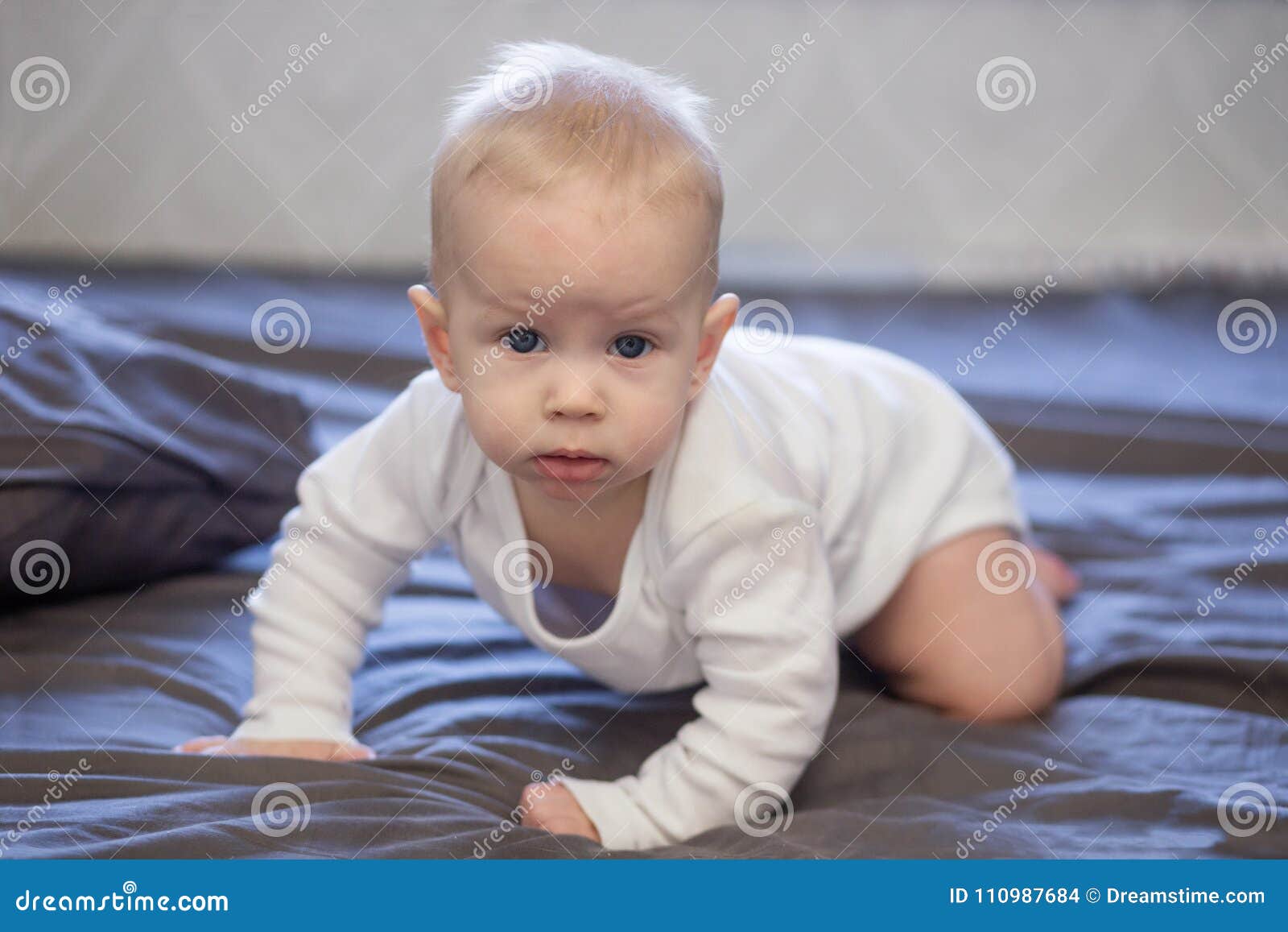 Happy Baby is Crawling on the Bed Stock Photo - Image of bedroom, lamp ...