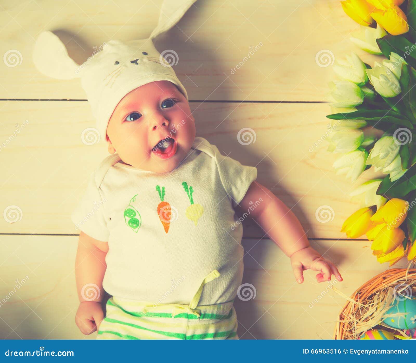 Happy Baby with Easter Bunny Ears and Flowers Stock Photo - Image of ...