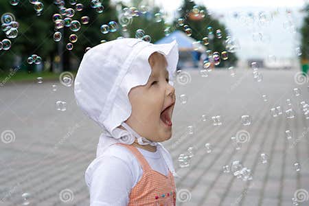 Happy Baby with Soap Bubbles Stock Photo - Image of bubbles, little ...