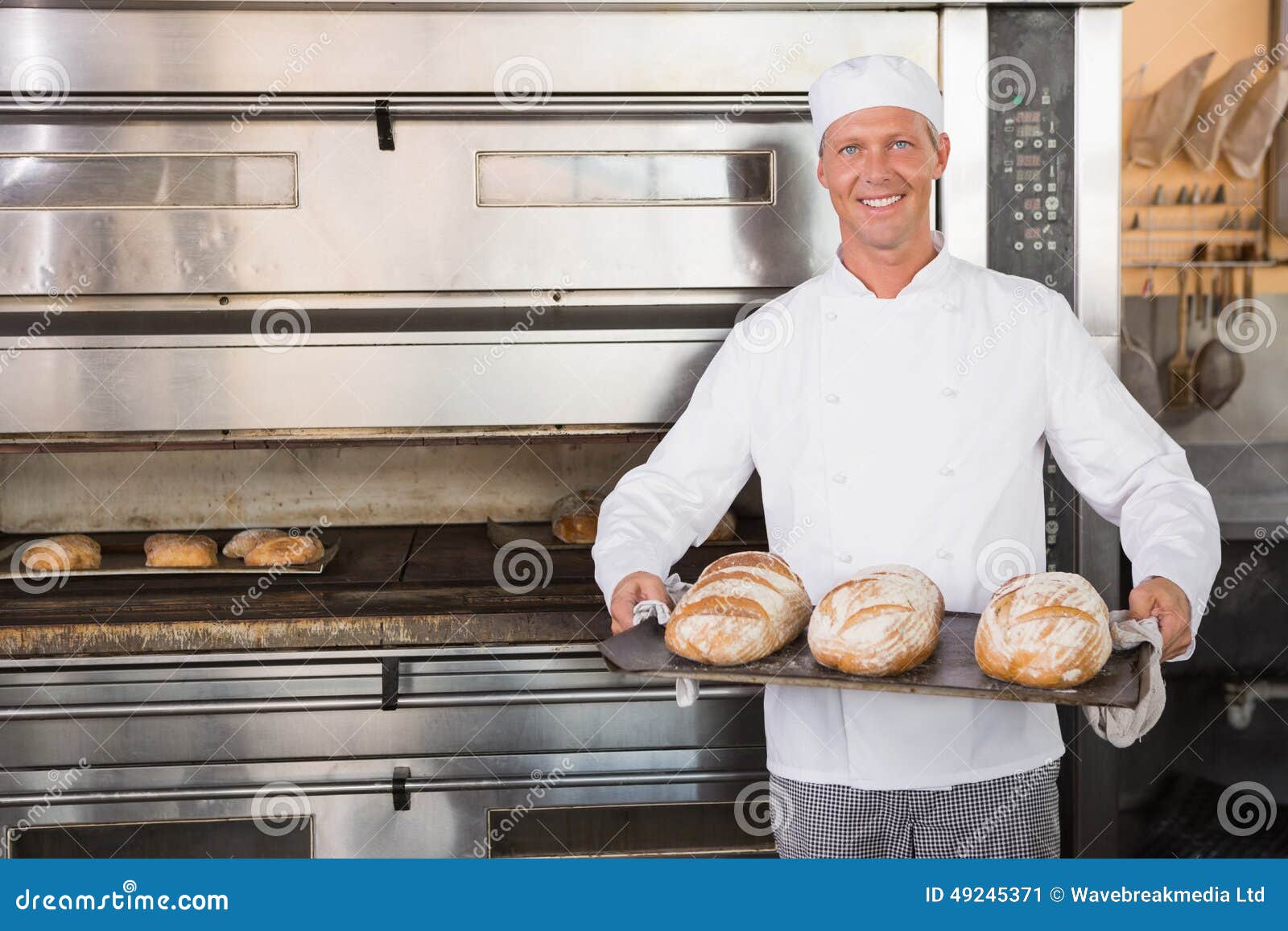 Happy Baker Holding Tray of Fresh Bread Stock Image - Image of chef ...