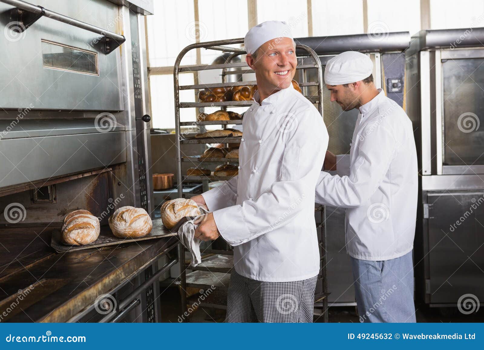Happy Baker Holding Tray of Fresh Bread Stock Photo - Image of oven ...