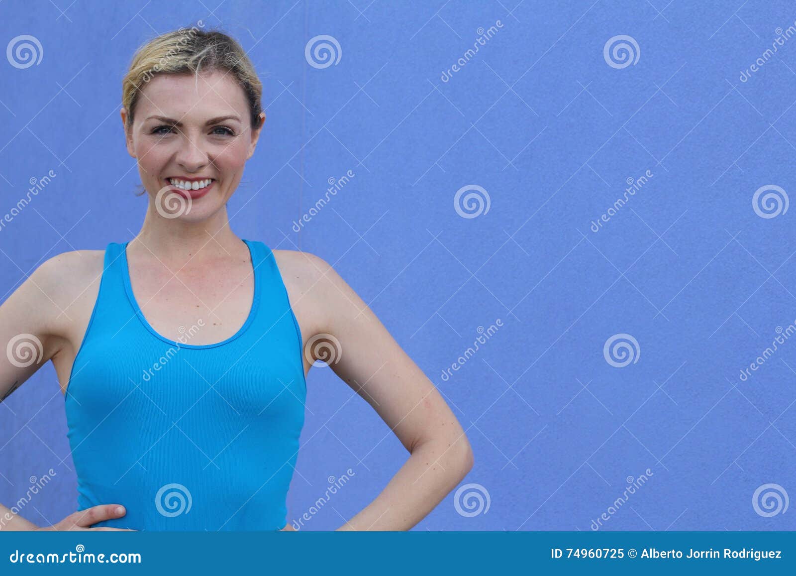 Happy Ballet Dancer Practicing Against Blue Wall Stock Image - Image of ...