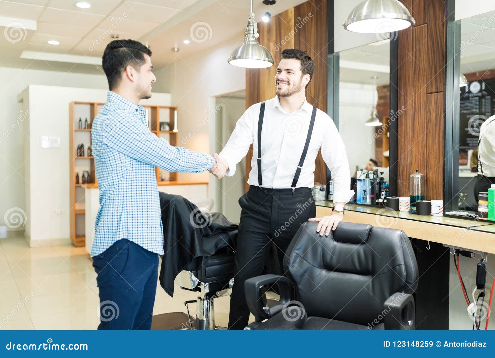 Barber Greeting Customer with a Handshake in Shop Stock Image - Image ... Barber Greeting Customer with a Handshake in Shop Stock Image - Image ...