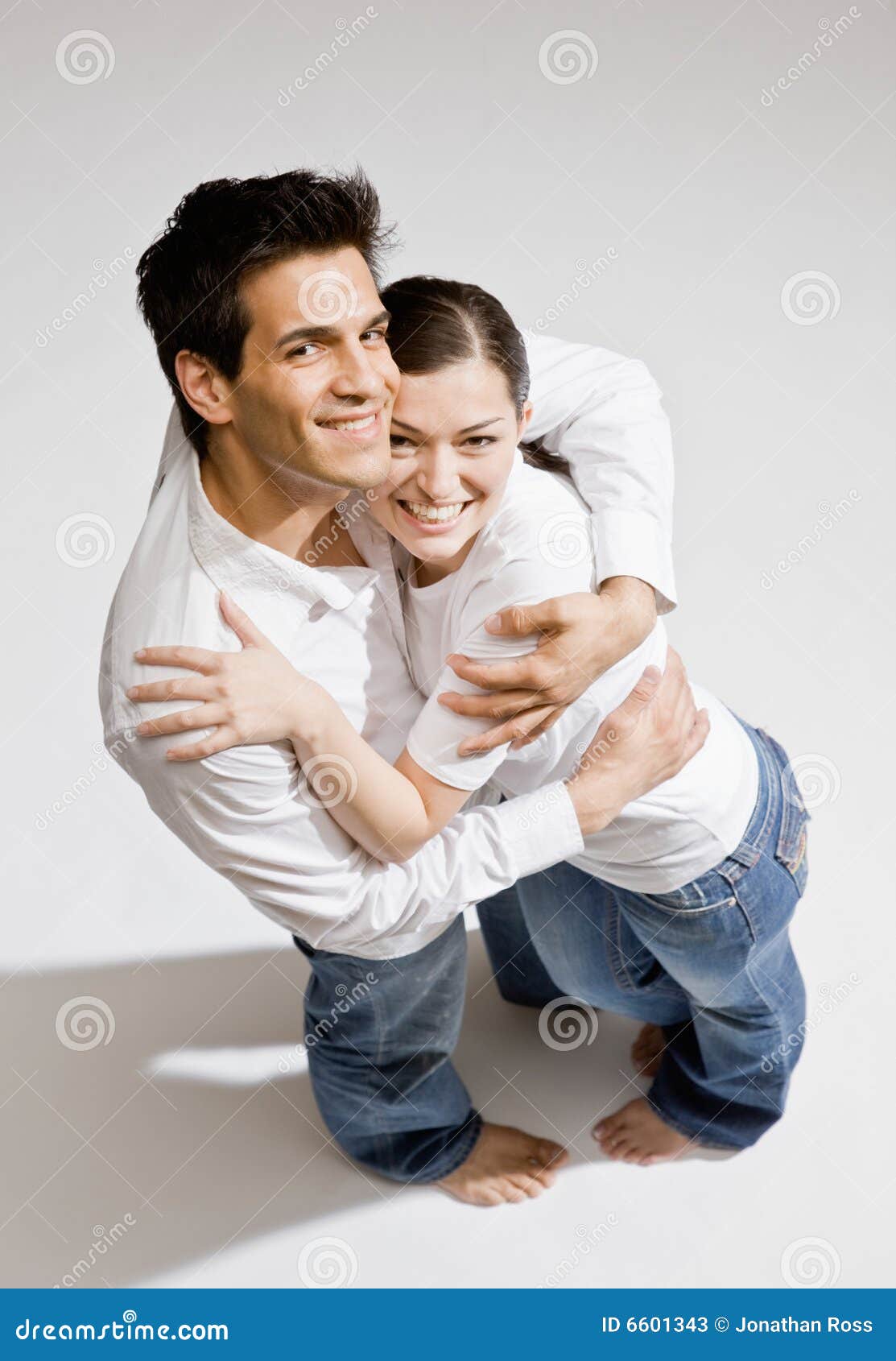 Happy Barefoot Couple Hugging Stock Image - Image of happy, female: 6601343