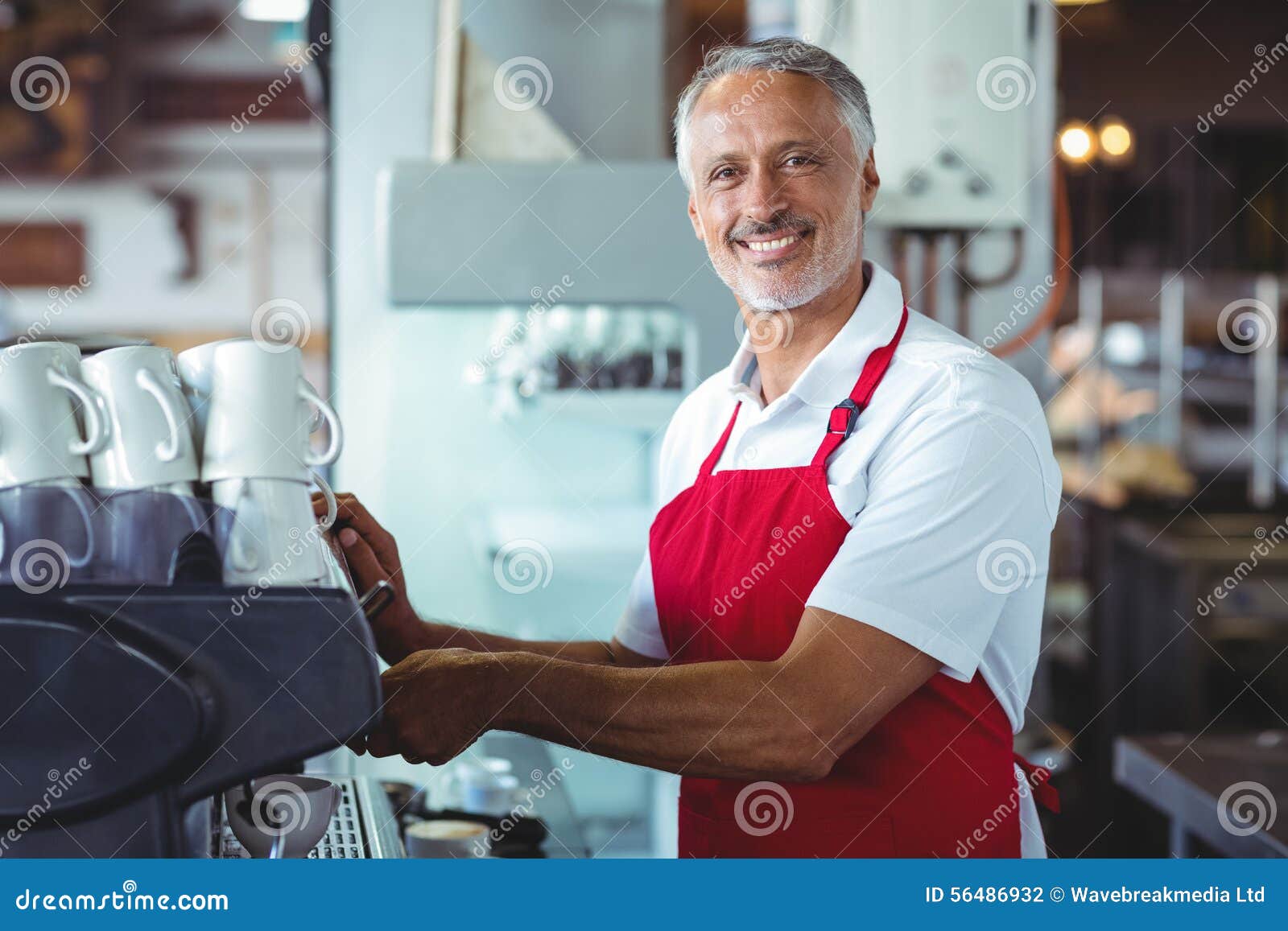 Happy Barista Smiling At Camera And Using The Coffee Machine Royalty ...