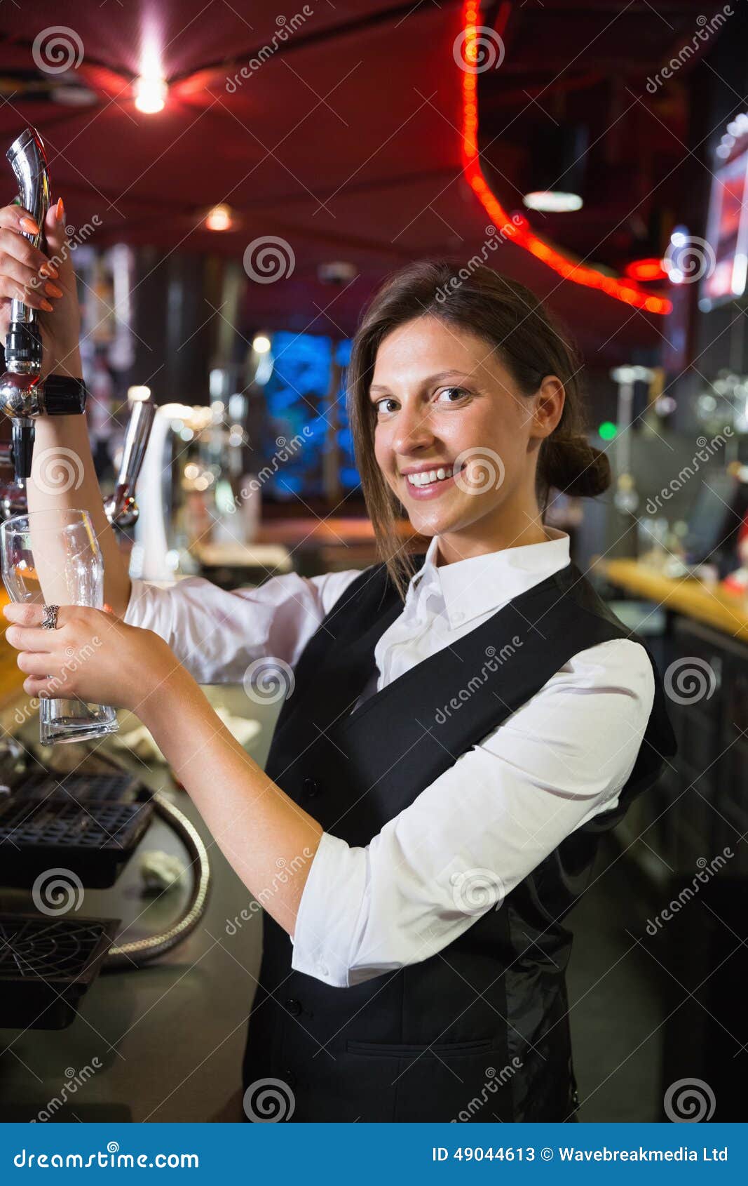 Happy Barmaid Pulling a Pint of Beer Stock Image - Image of staff ...