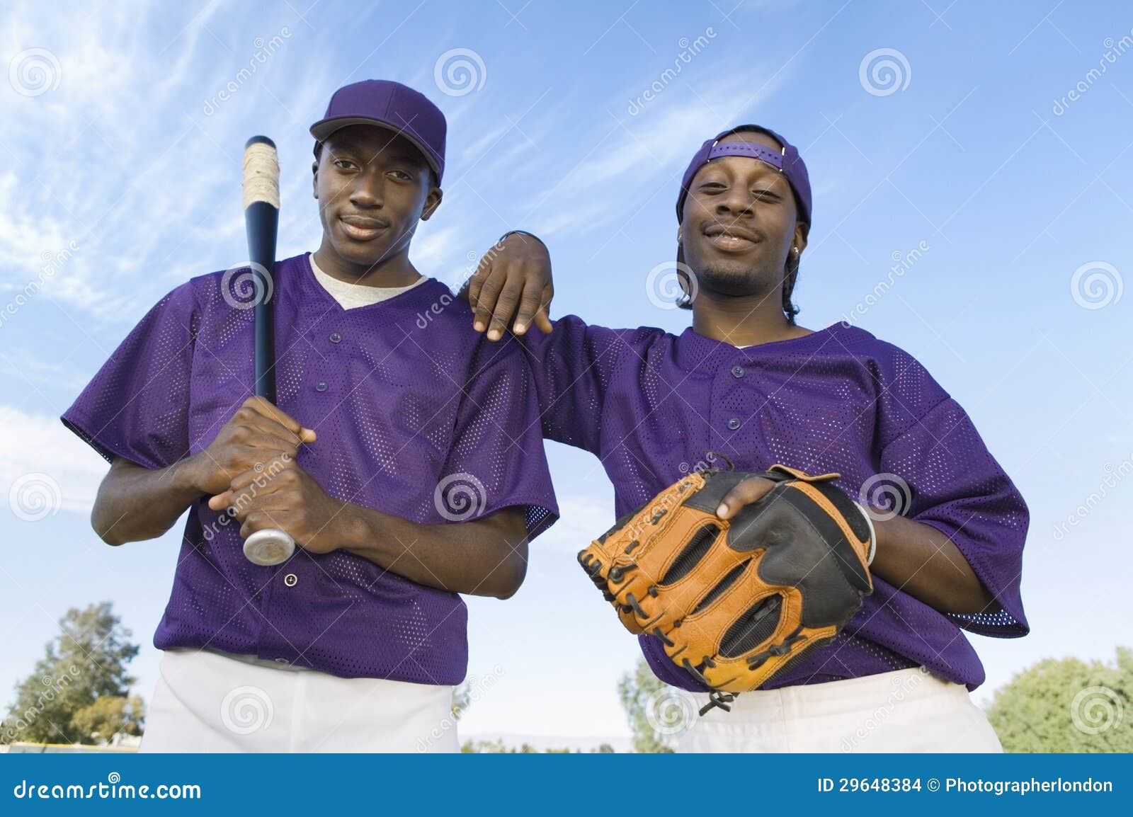 Happy Baseball Players Standing Against Sky Stock Photo - Image of race ...