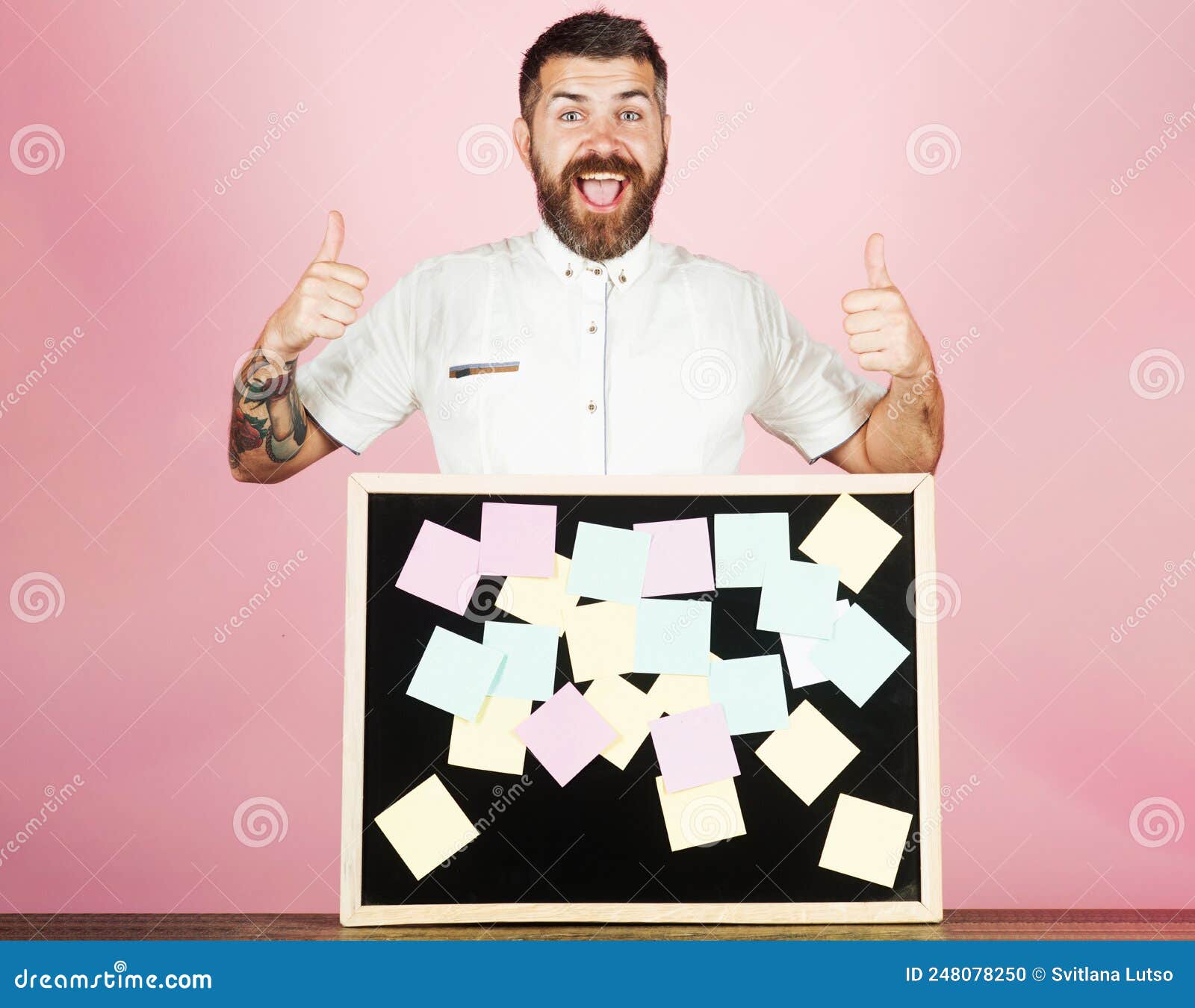 Happy Bearded Man Standing at Table with Sticky Notes on Blackboard ...