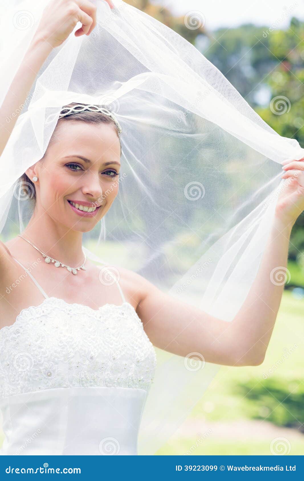 Happy Beautiful Bride Unveiling Self in Garden Stock Image - Image of ...