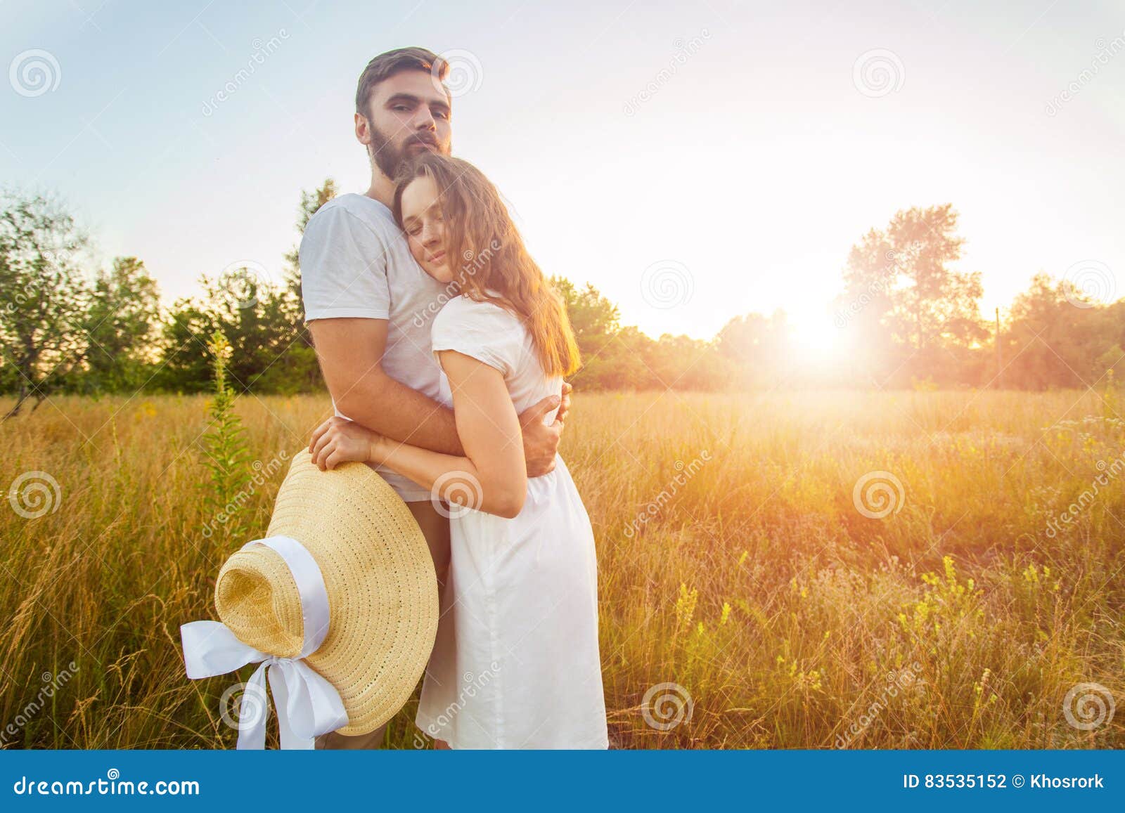 Happy Beautiful Couple Hugs in Park in the on the Sunset. Stock Photo ...