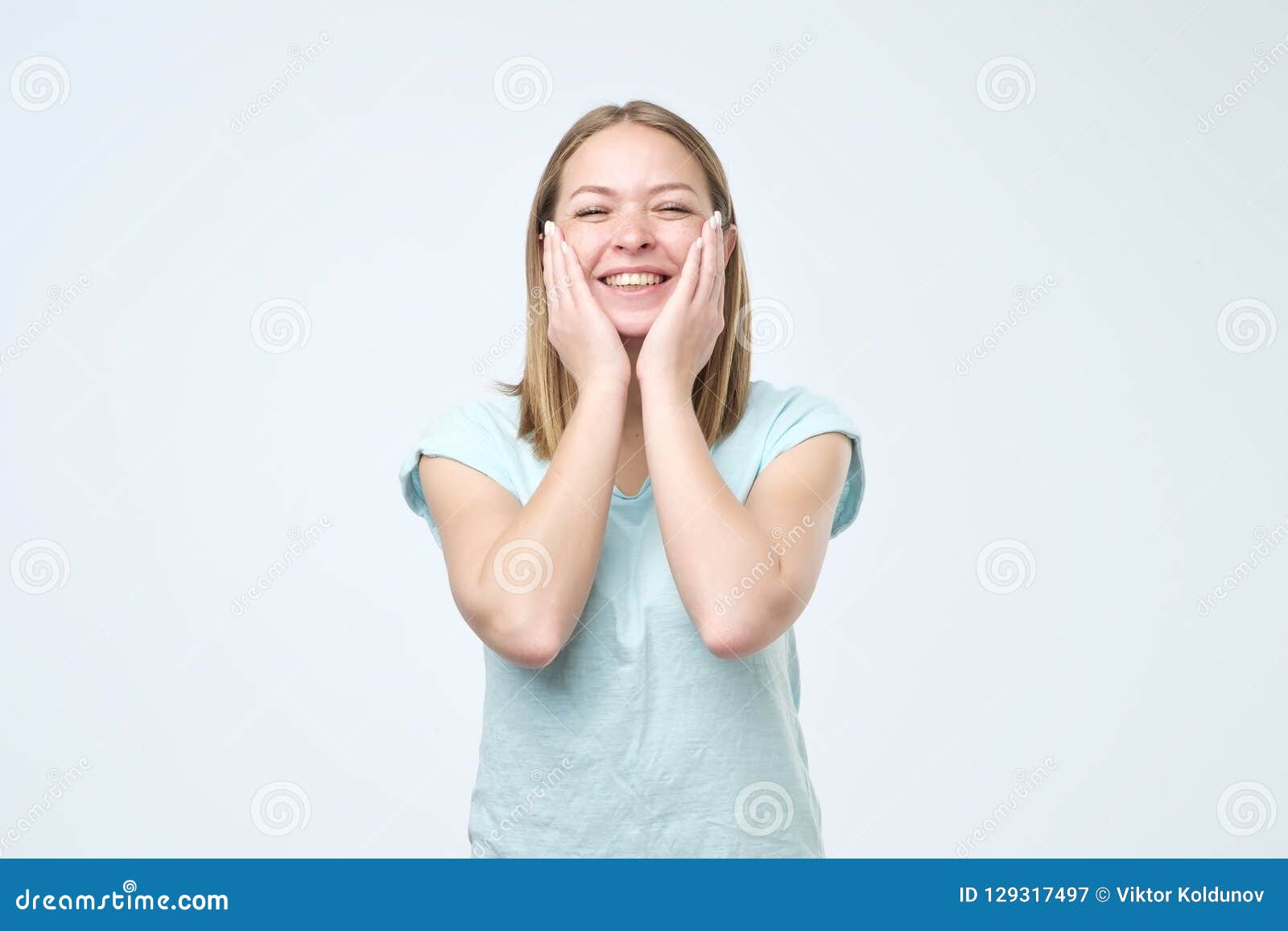Happy Beautiful Girl Holding Her Cheeks With A Laugh Like Saying I Love