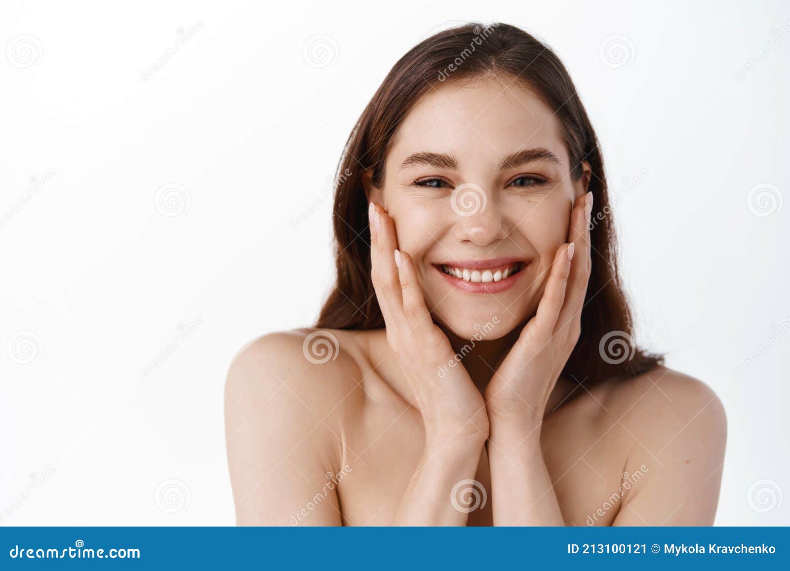 Happy Beautiful Girl Holding Her Cheeks With A Laugh Looking To The