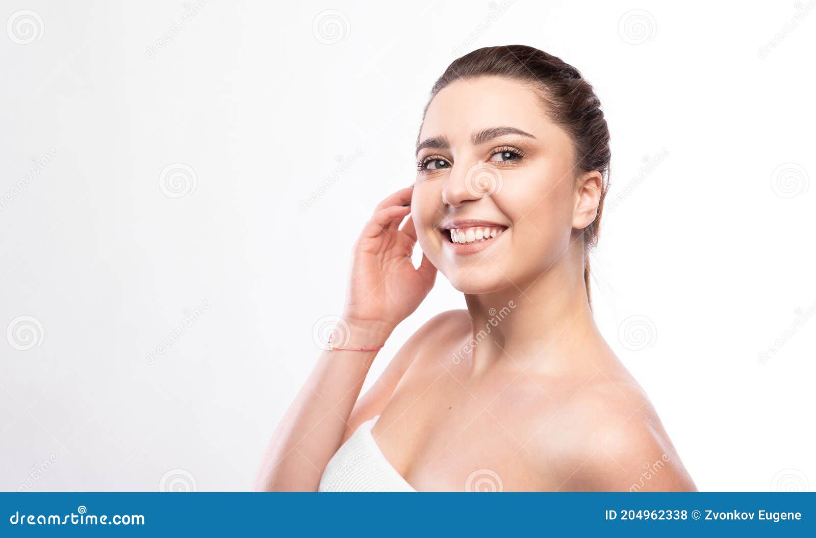 Happy Beautiful Girl Holding Her Cheeks With A Laugh Looking To The