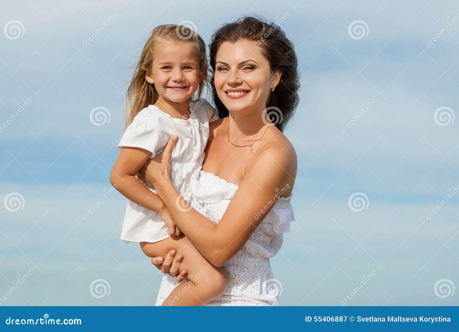 Happy Beautiful Mother And Daughter Enjoying Beach Time Stock Image