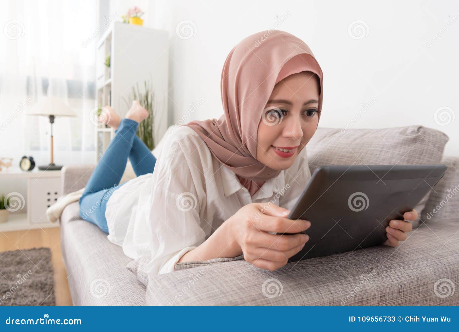 Happy Beautiful Muslim Lady Lying Down on Sofa Stock Image - Image of ...