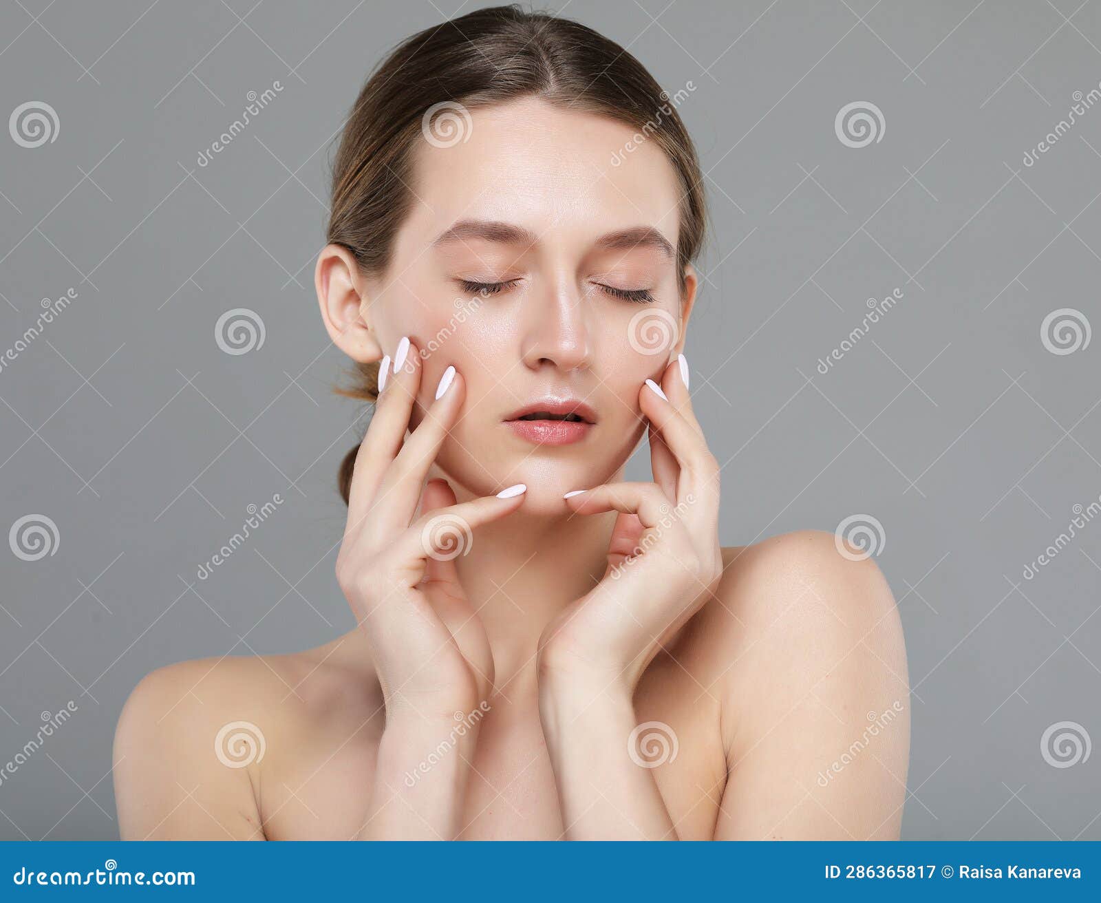 Happy Beautiful Woman Holding Her Cheeks A Laugh Looking To The Side