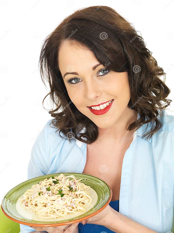 Happy Beautiful Young Woman Holding A Plate Of Spaghetti Carbonara