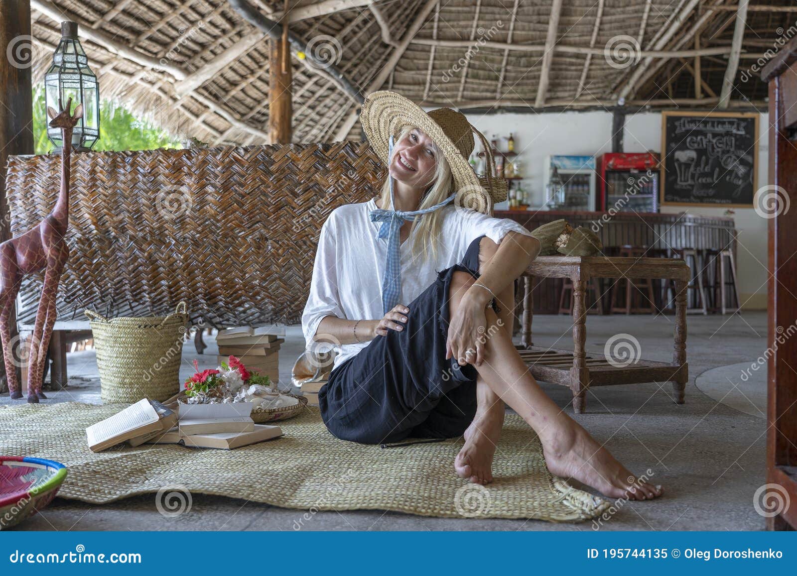 Happy Beautiful Young Woman In A Straw Hat On A Tropical Beach Close